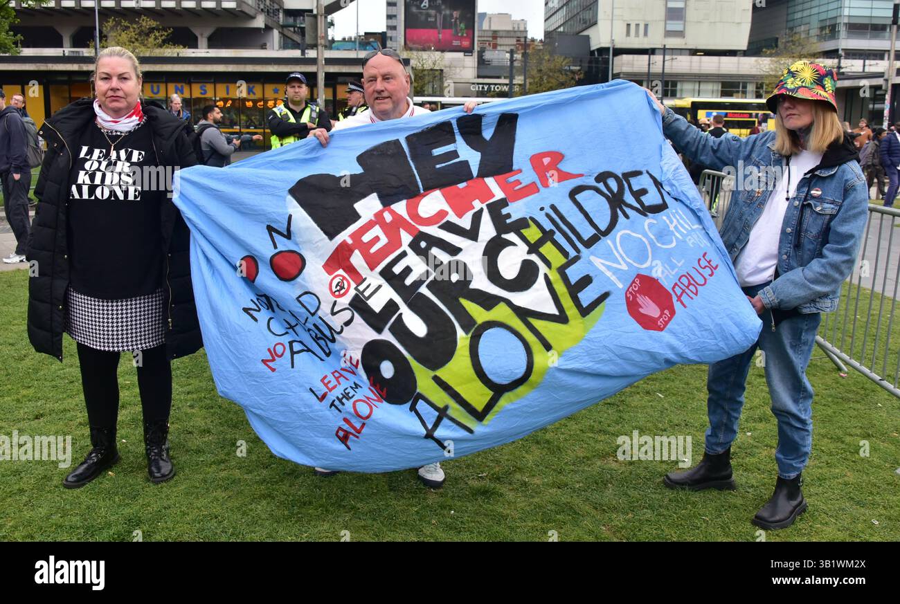 Manchester, UK, 26th April, 2025. Protesters carry banner: 'Hey teacher ...