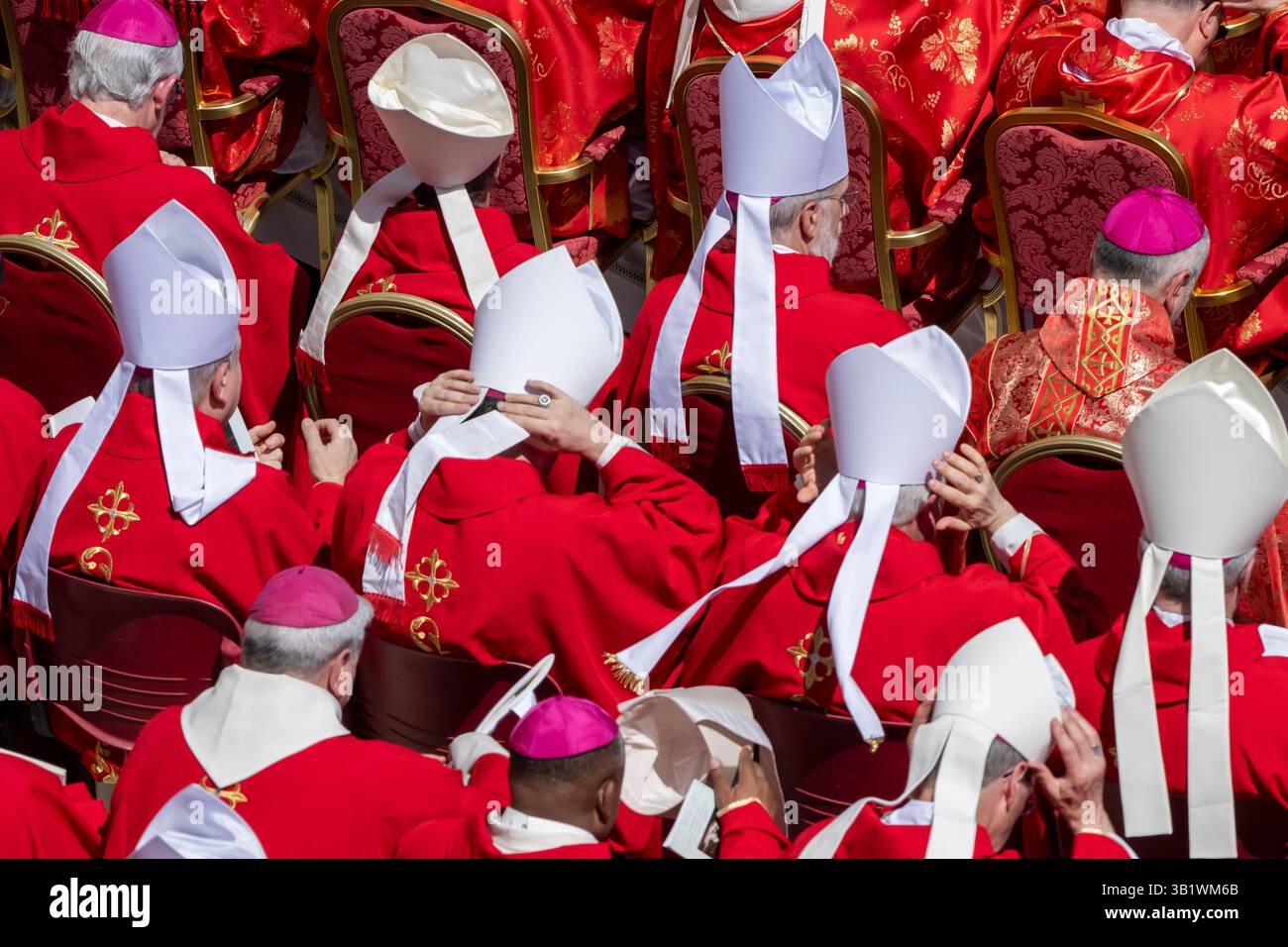 Vatican City, Vatican. 26th Apr, 2025. Cardinals adjust their hats ...