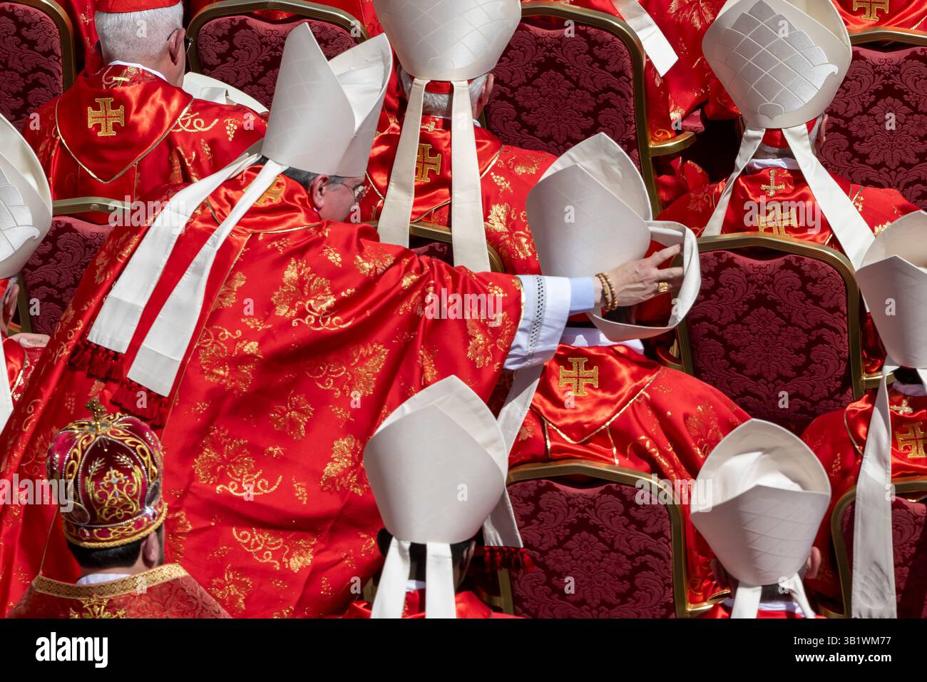 Vatican City, Vatican. 26th Apr, 2025. Cardinals adjust their hats ...