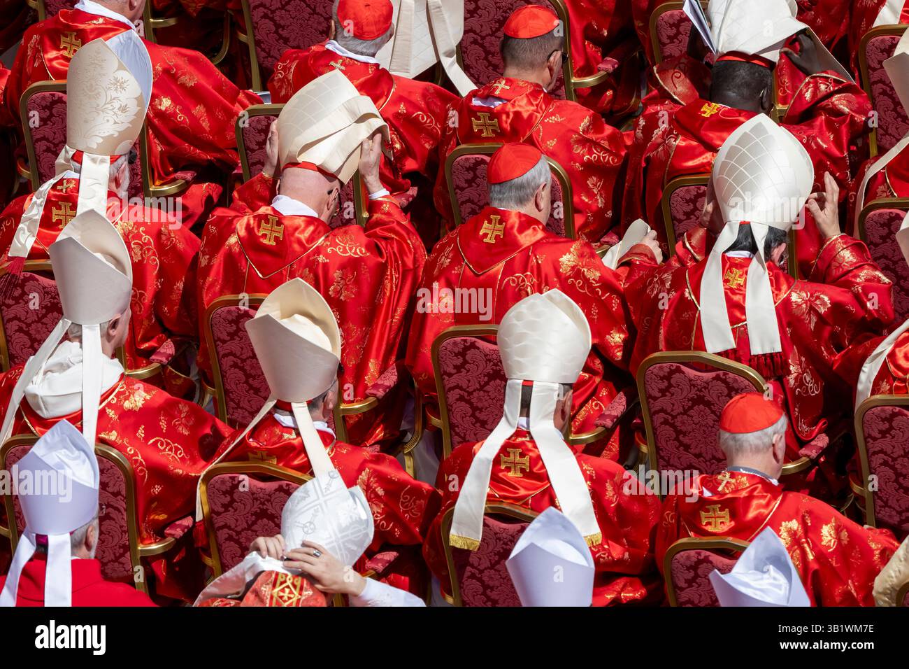 Vatican City, Vatican. 26th Apr, 2025. Cardinals adjust their hats ...