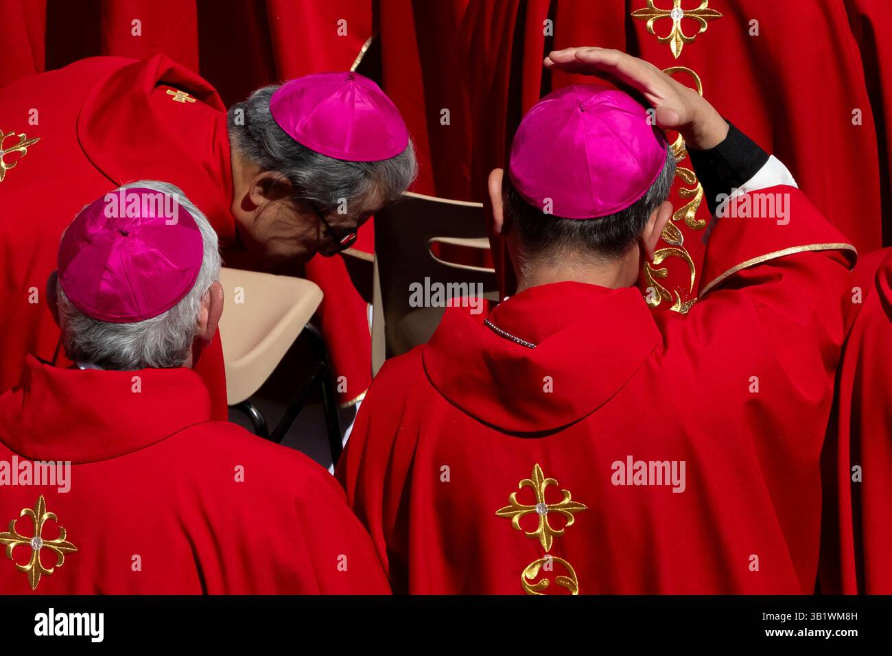 Vatican City, Vatican. 26th Apr, 2025. Cardinals adjust their hats ...