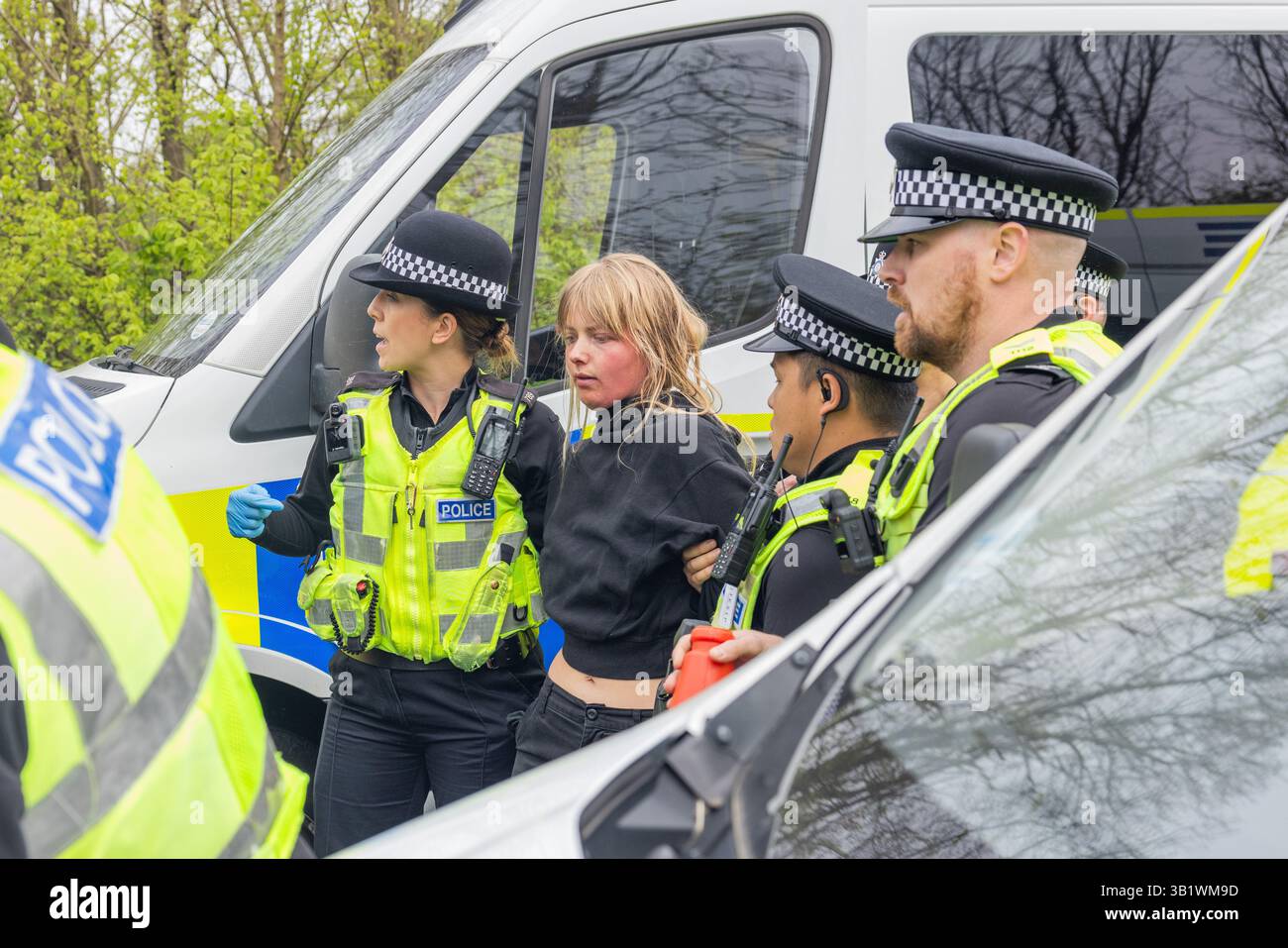 Huntingdon, UK. 26 APR, 2025. Arrested protestor is put into a police ...