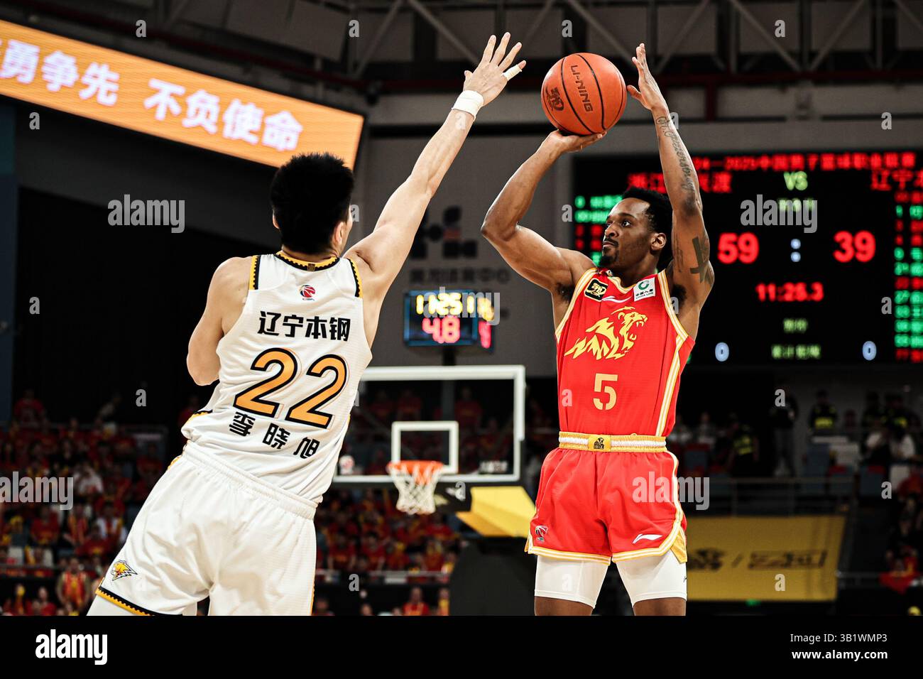Hangzhou, China's Zhejiang Province. 26th Apr, 2025. Barry Brown (R) of Zhejiang Lions shoots ...
