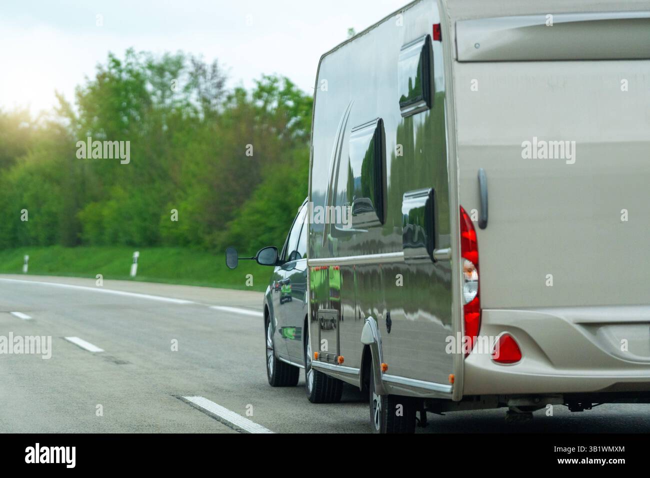 Bavaria, Germany - April 26, 2025: A car pulls a caravan along the ...