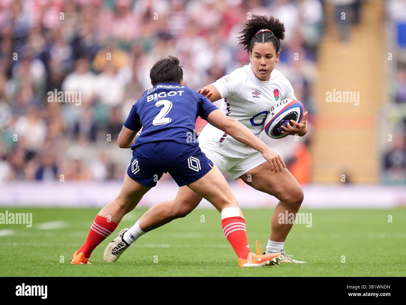 England's Tatyana Heard (right) attempts to get past France's Manon ...