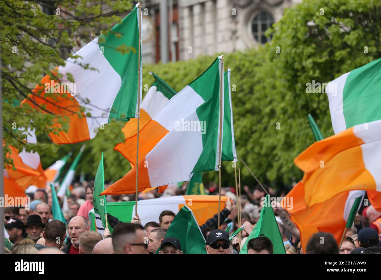 Dublin, Ireland - 26th April 2025 - Irish flags held up during the ...