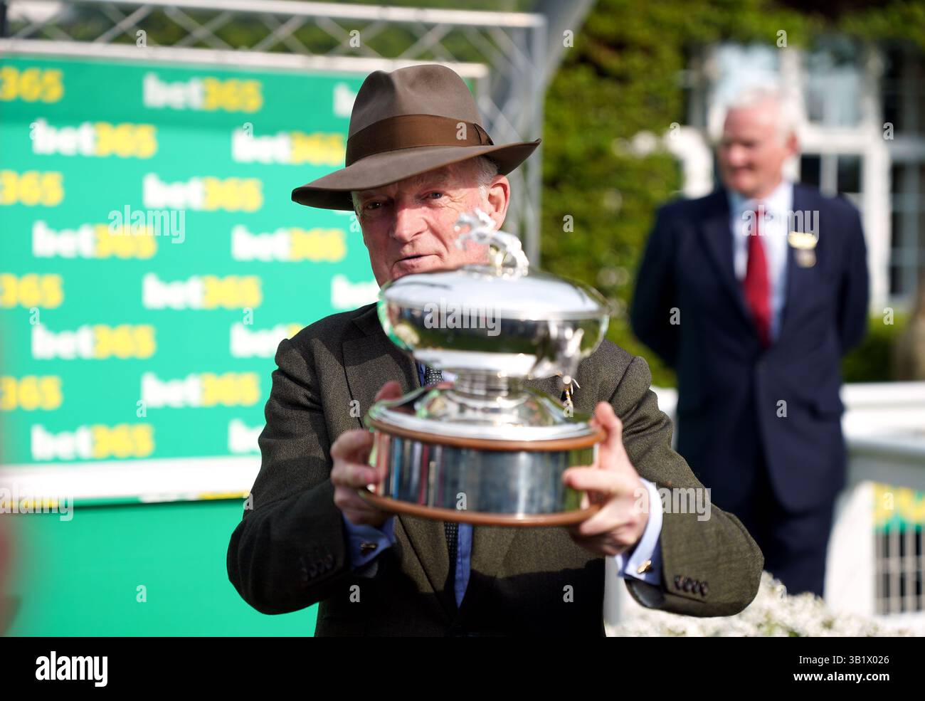 Trainer Willie Mullins with the Champion Jump trainer trophy at Sandown ...