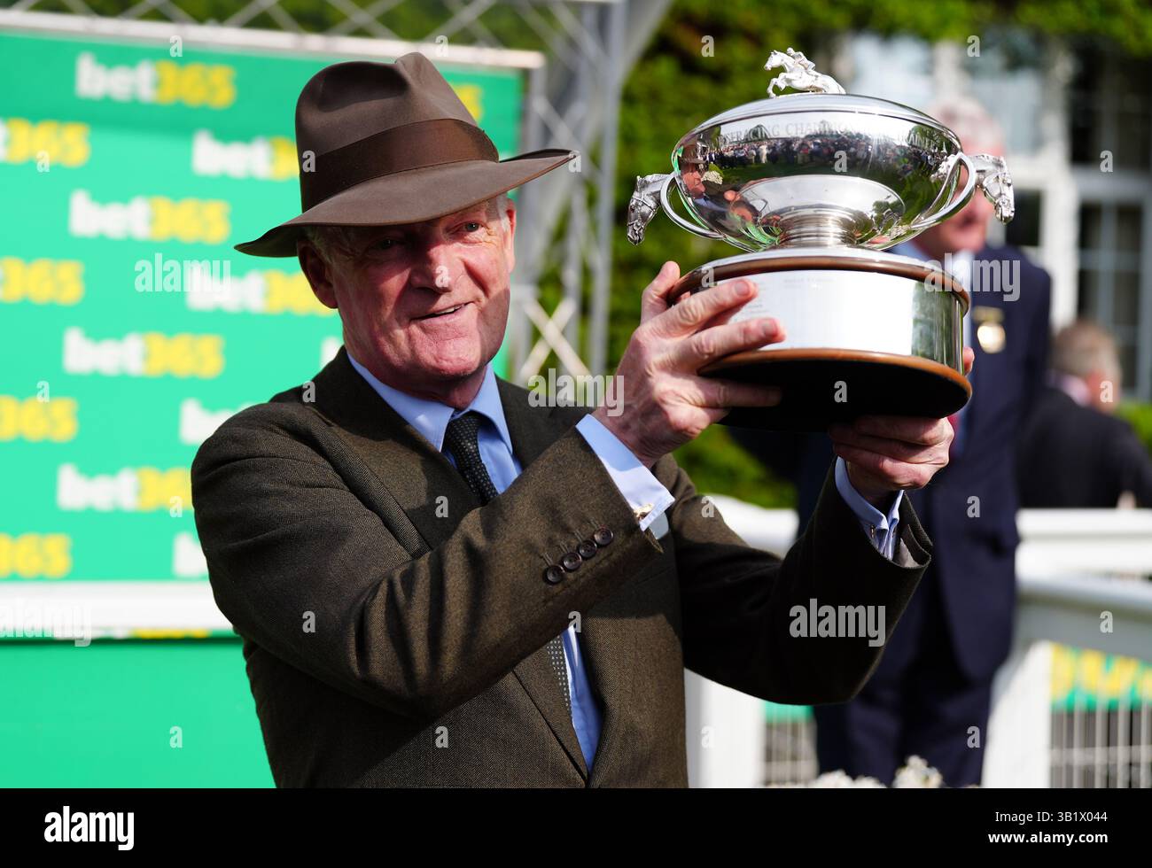 Trainer Willie Mullins with the Champion Jump trainer trophy at Sandown ...