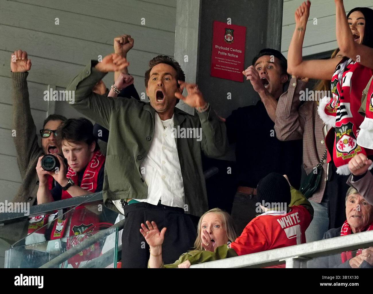 Wrexham co-owners Ryan Reynolds (left) and Rob McElhenney celebrate after Wrexham scored their ...