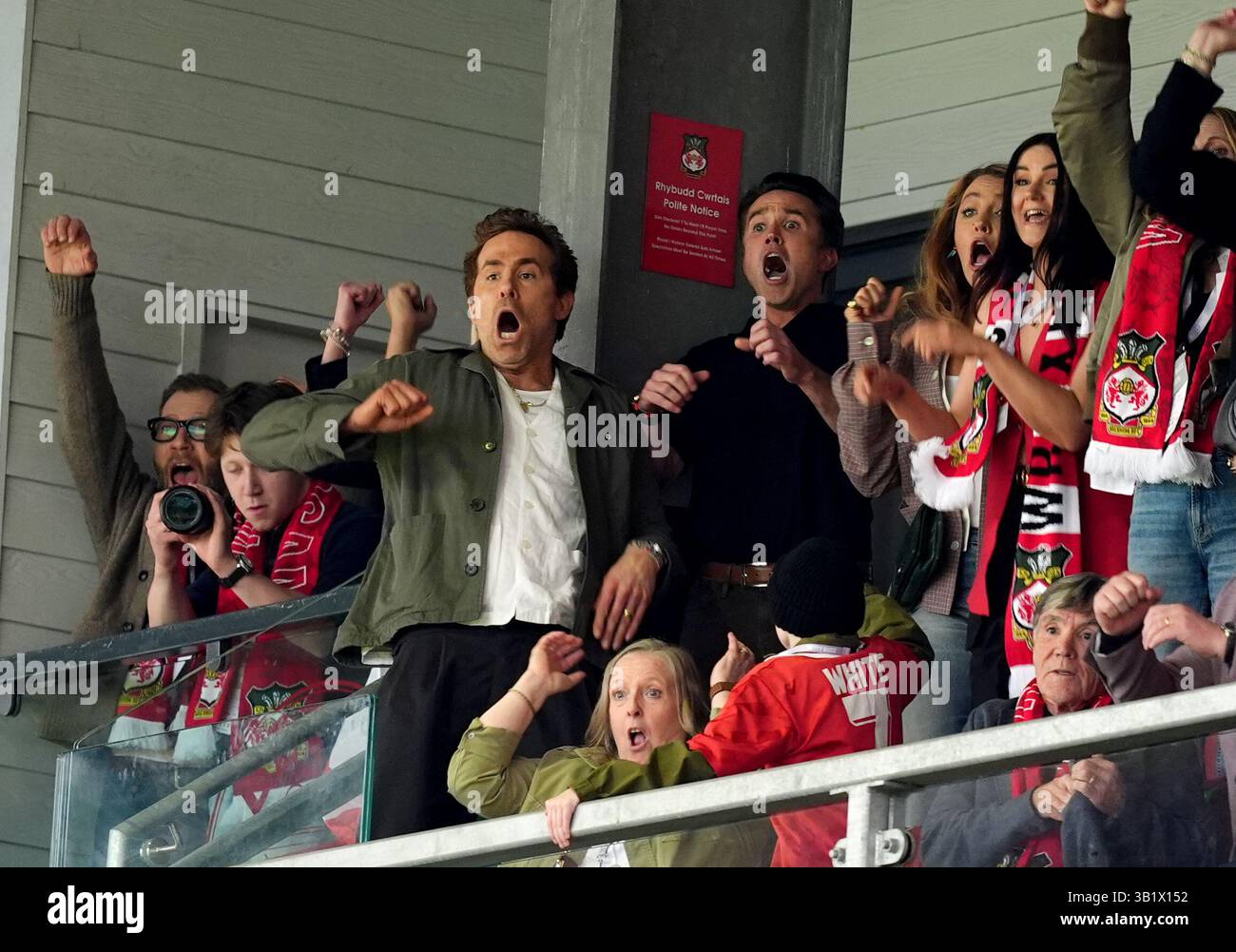 Wrexham co-owners Ryan Reynolds (left) and Rob McElhenney celebrate after Wrexham scored their ...