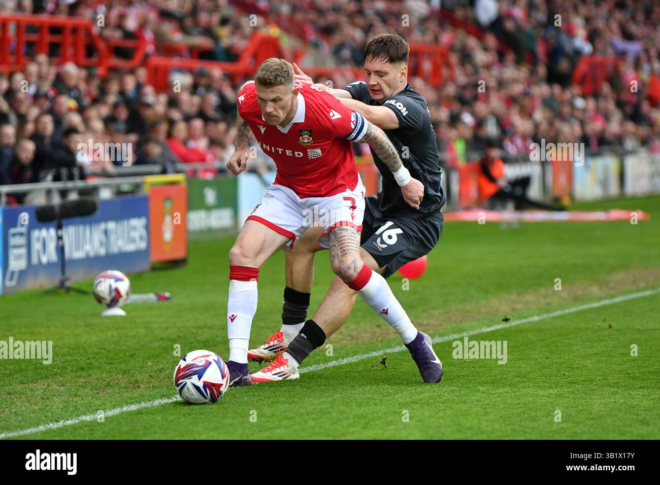 Wrexham, UK. 26th Apr 2025. James McClean and Josh Edwards during the Sky Bet EFL League One ...