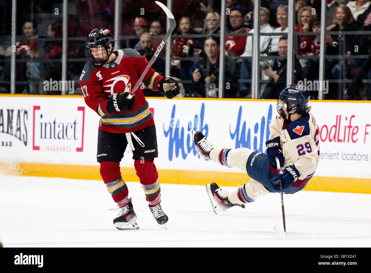 Montreal Victoire's Marie-Philip Poulin (29) takes an open ice hit by ...