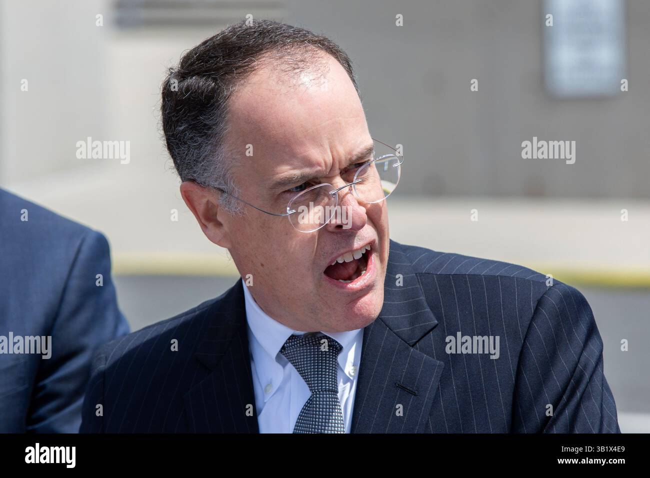 Acting U.S. Attorney John J. Durham speaks during a news conference ...