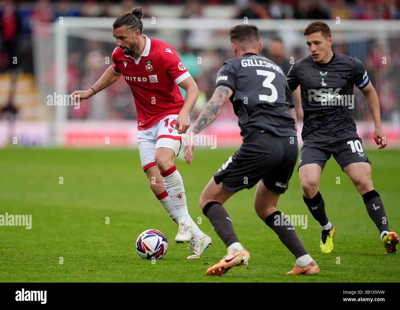Wrexham's Jay Rodriguez (left) battles for the ball with Charlton ...