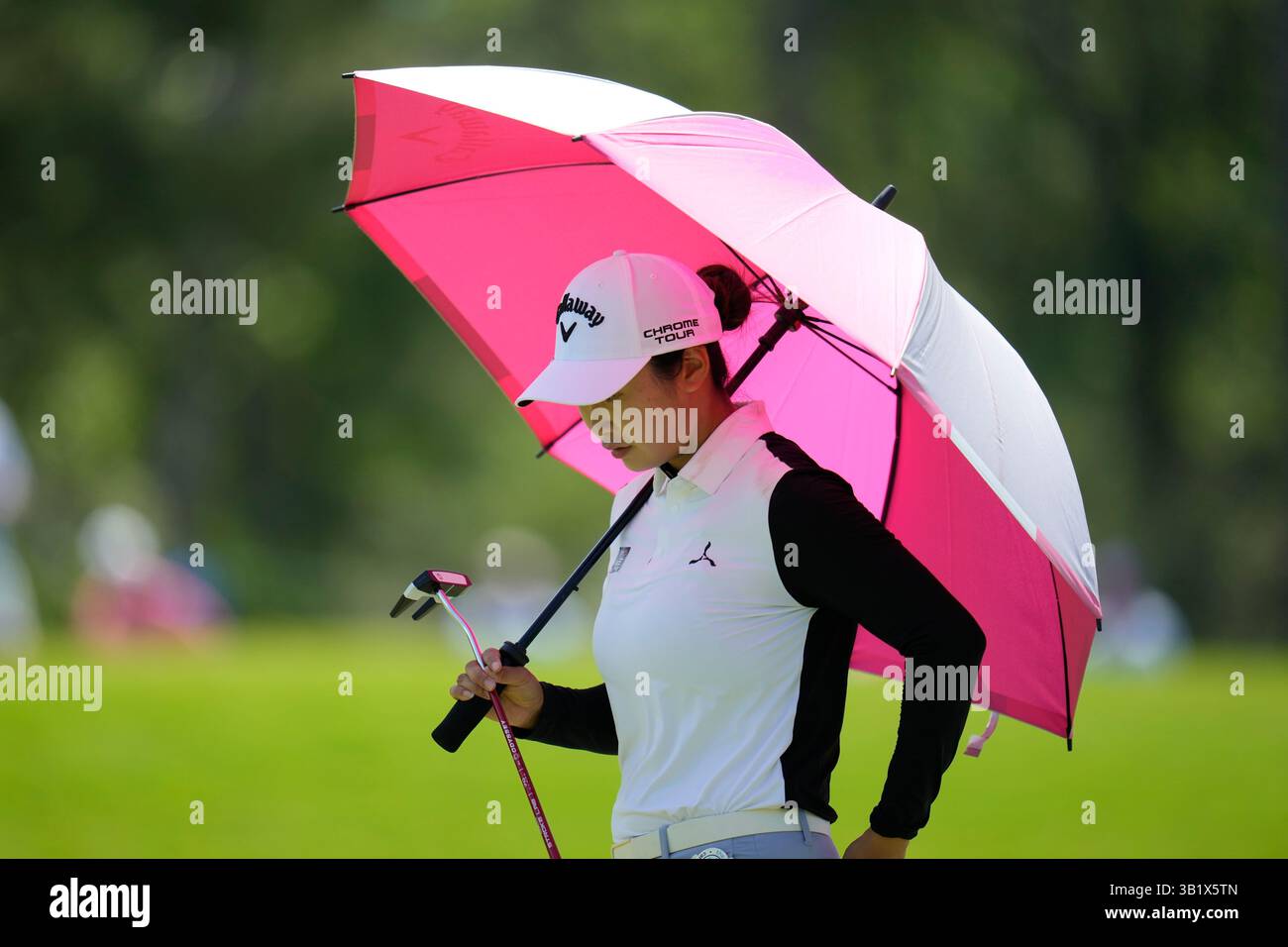 Yan Liu, of China, walks on the second green during the third round of ...