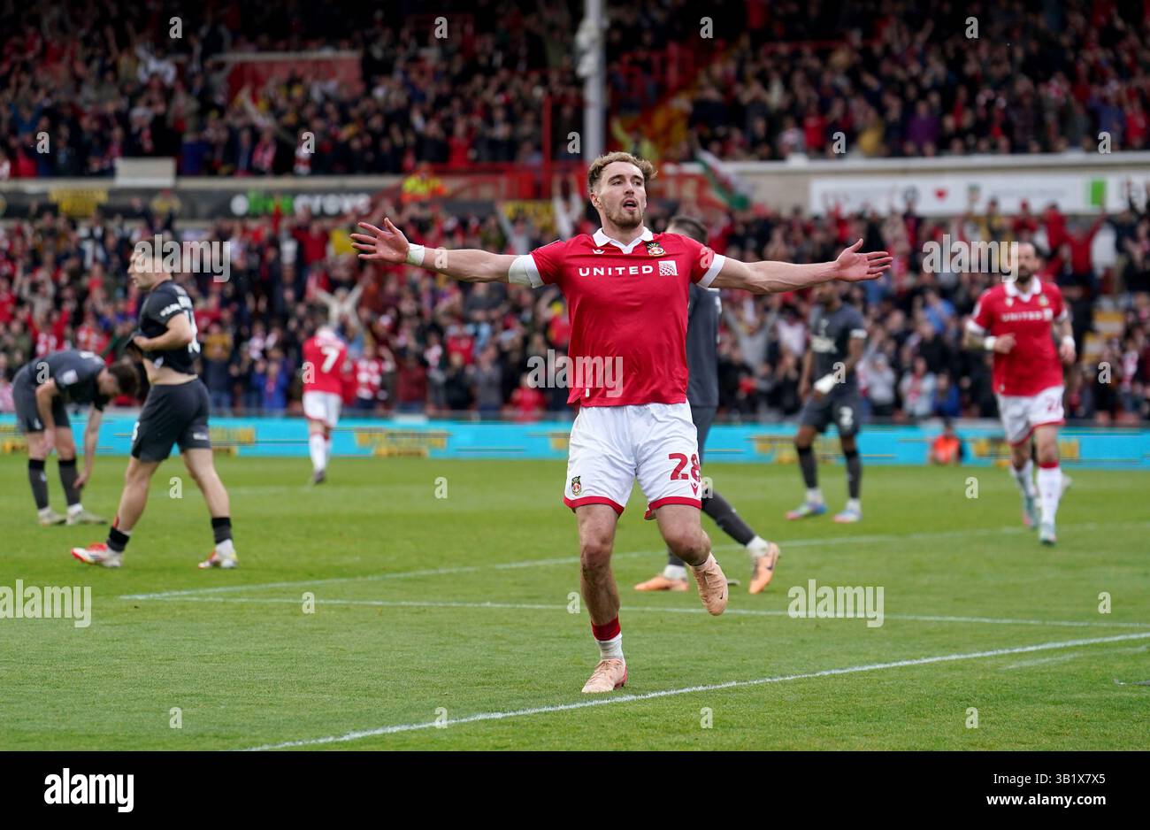Wrexham's Sam Smith celebrates after scoring his sides third goal ...