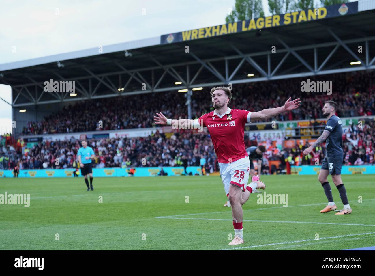 Wrexham's Sam Smith celebrates after scoring his side's third goal ...