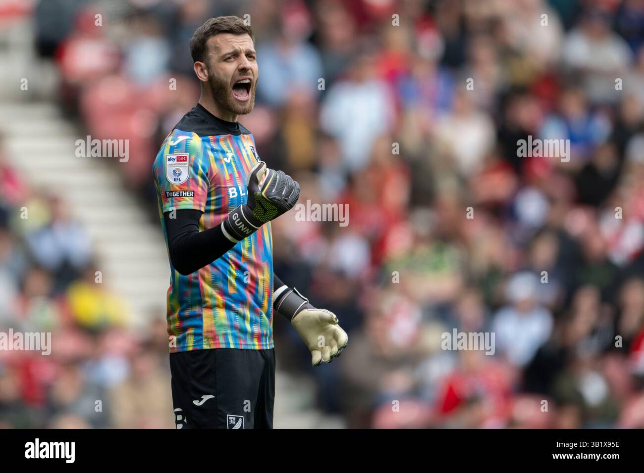 Norwich City Goalkeeper Angus Gunn shouts instruction to his defensive ...