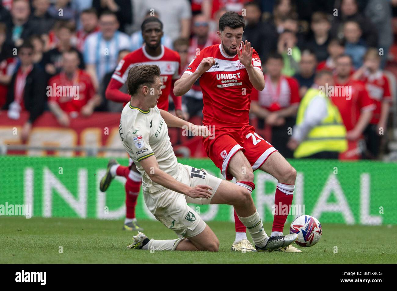 Middlesbrough's Finn Azaz is tackled by Norwich City's Ruairi ...