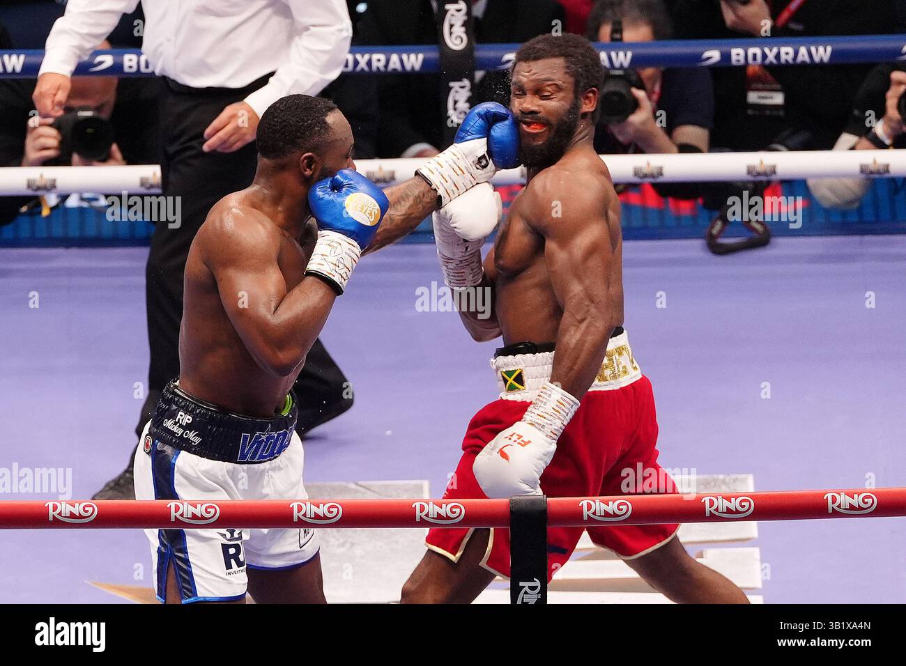 Viddal Riley (left) lands a punch on Cheavon Clarke during their ...
