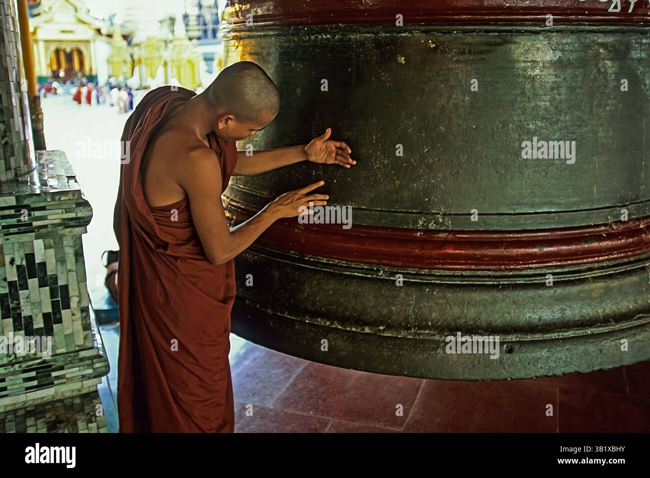 Myanmar Burma Yangon Rangoon Shwedagon Pagoda A buddhist monk reading ...