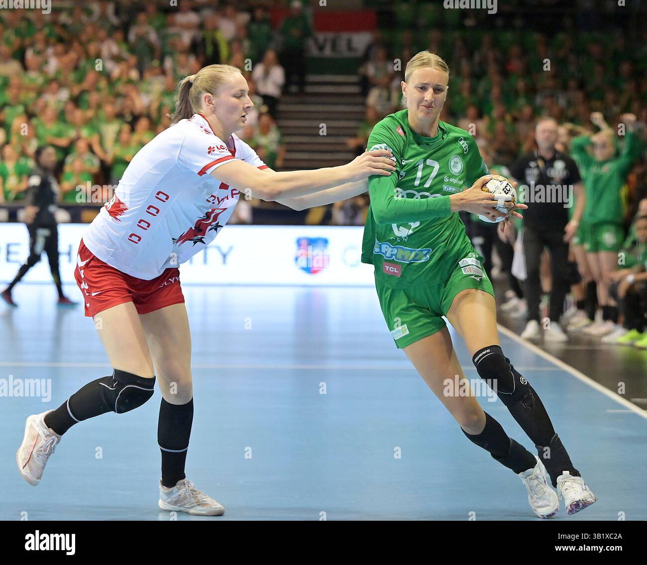 Kelly Dulfer of Gyor, right, is challenged for the ball by Karolina ...