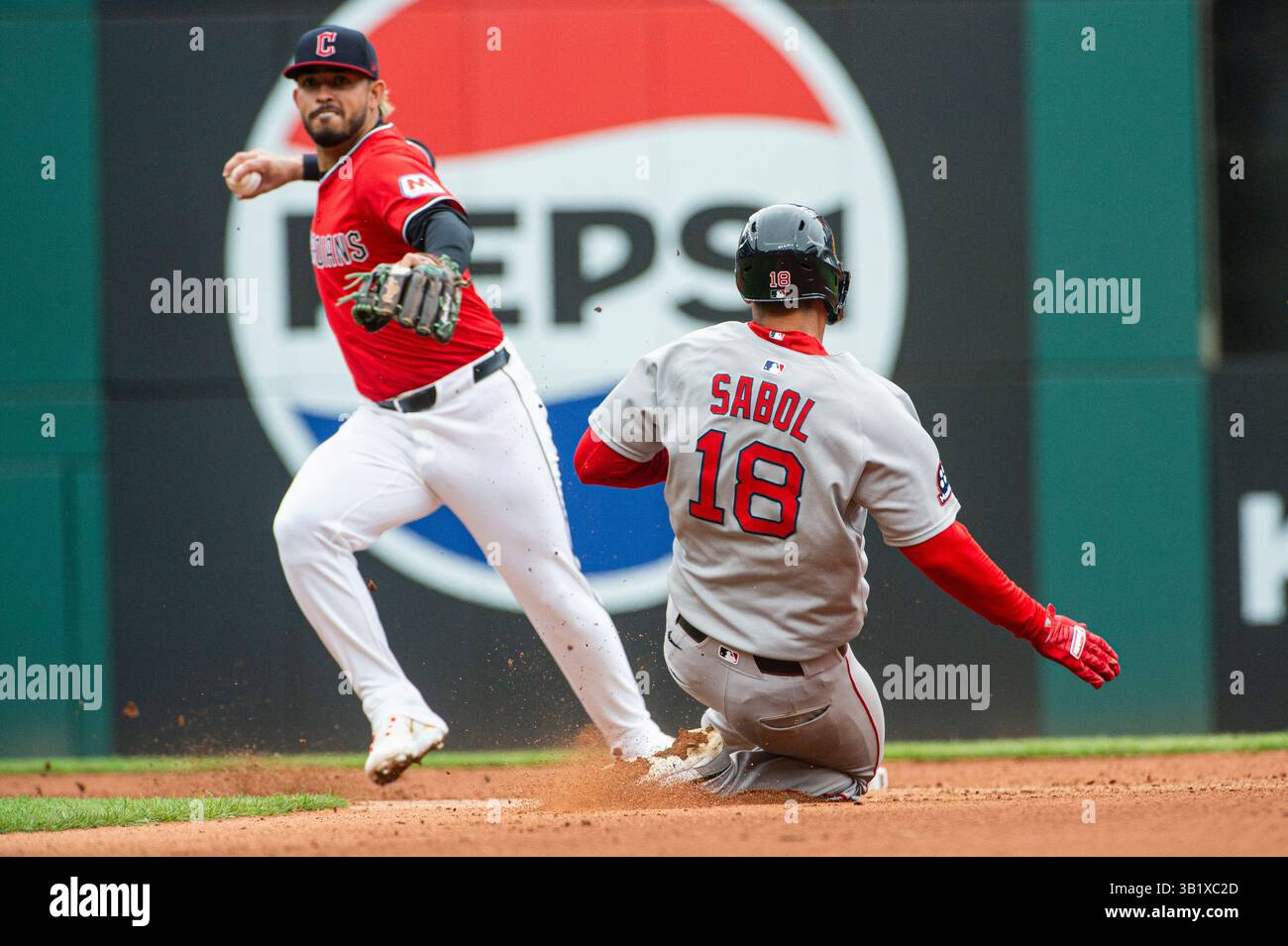 Cleveland Guardians' Gabriel Arias, left, forces out Boston Red Sox ...