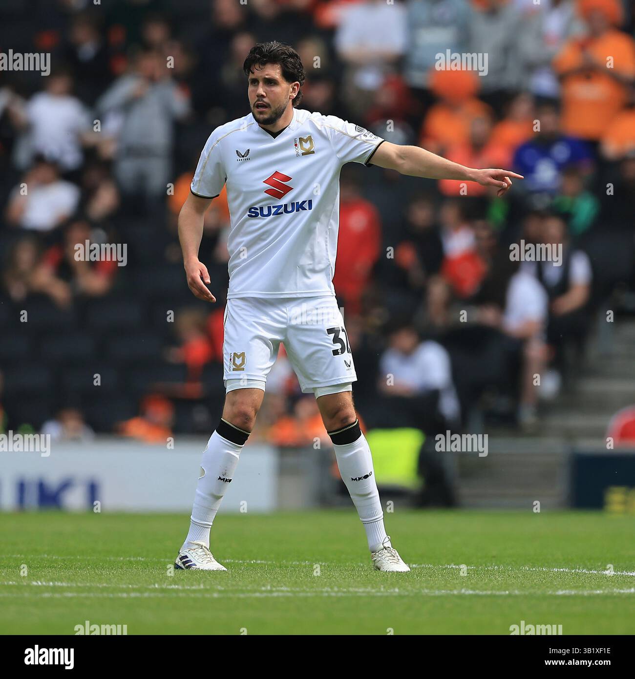 Milton Keynes Dons Defender Jack Sanders (32) Gestures to his teamates ...