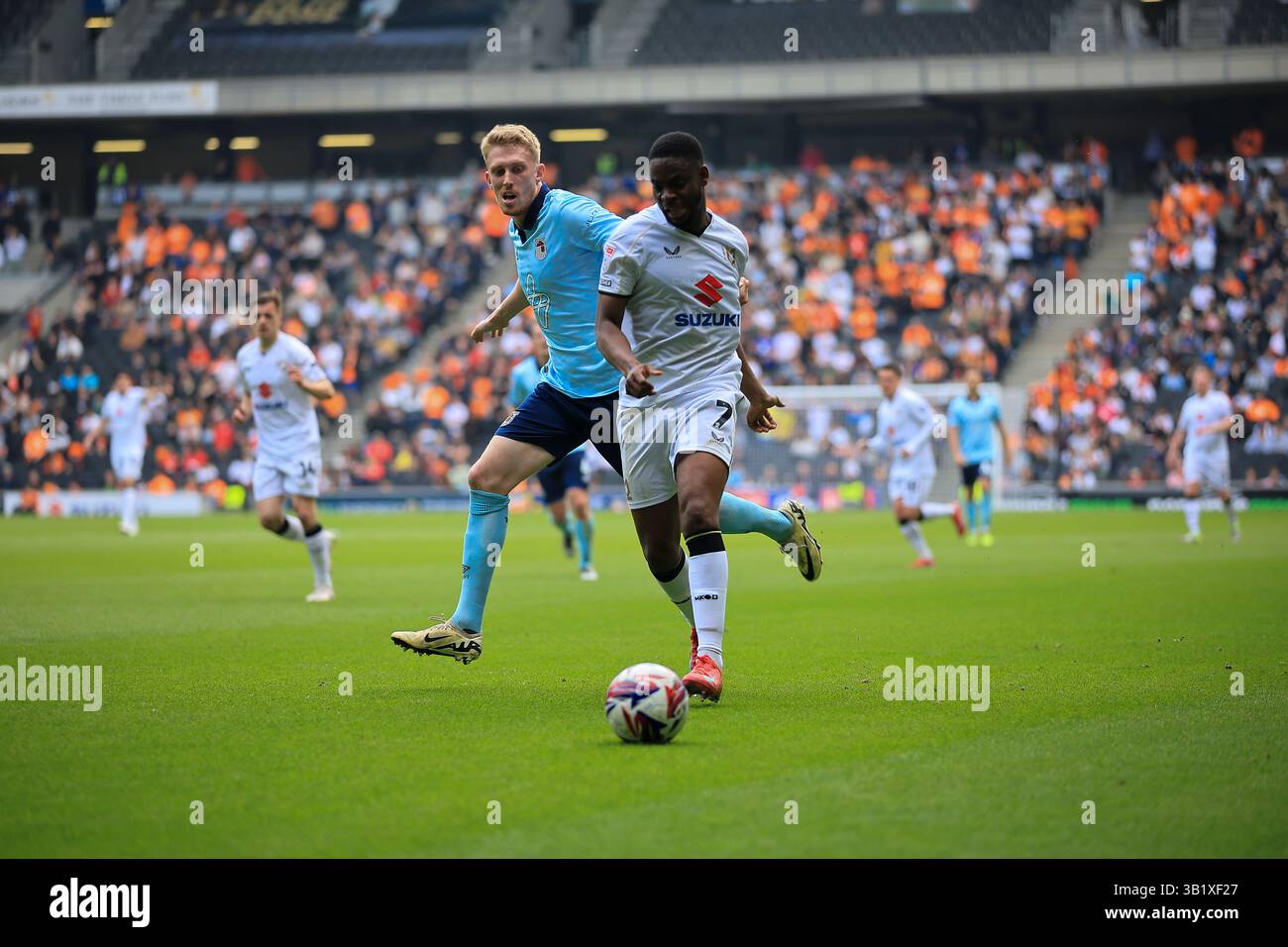 Milton Keynes Dons Forward Jonathan Leko (7) Under Pressure from ...