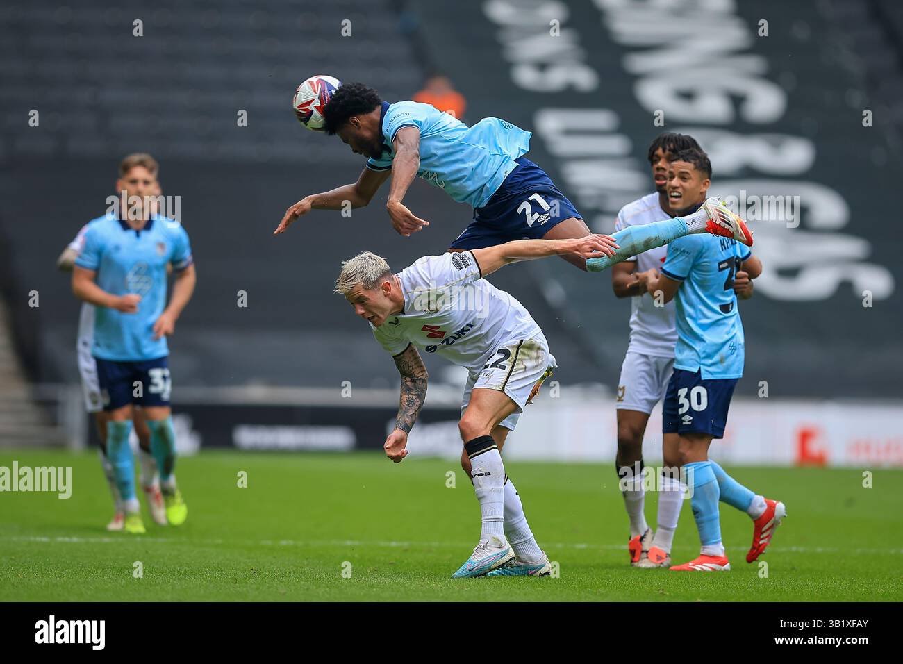 Grimsby Town Defender Tyrell Warren (21) Under Pressure from Milton ...