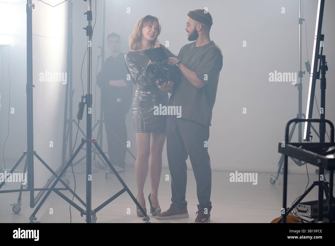 Woman director reviewing footage hi-res stock photography and images ...