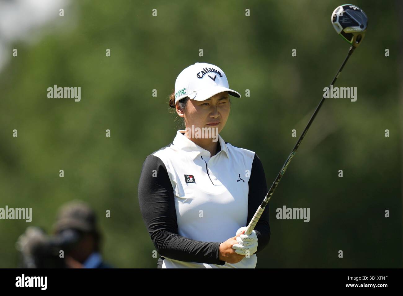 Yan Liu, of China, prepares to tee off on the second hole during the ...