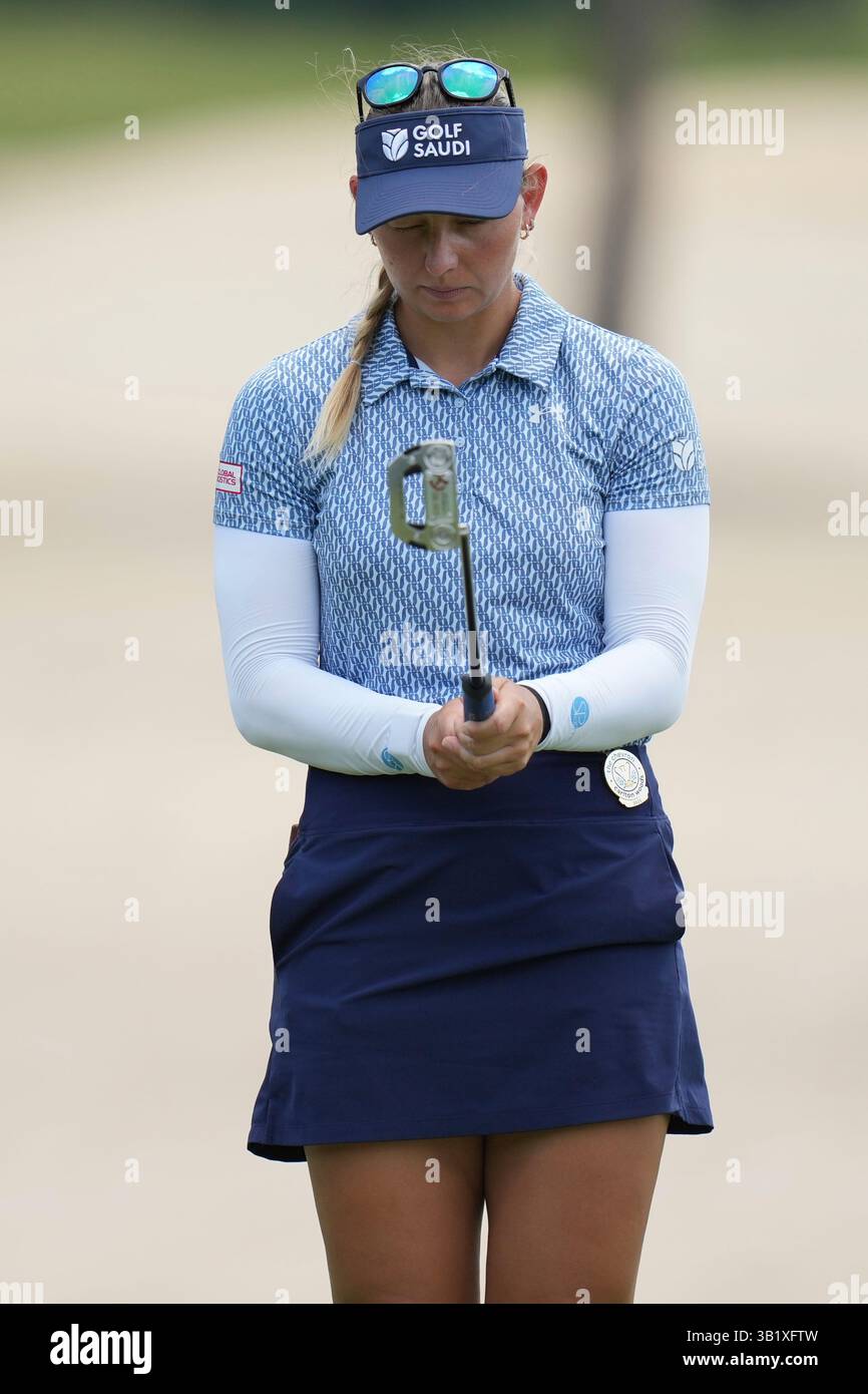 Emily Kristine Pedersen, of Denmark, lines up her putt on the eighth ...
