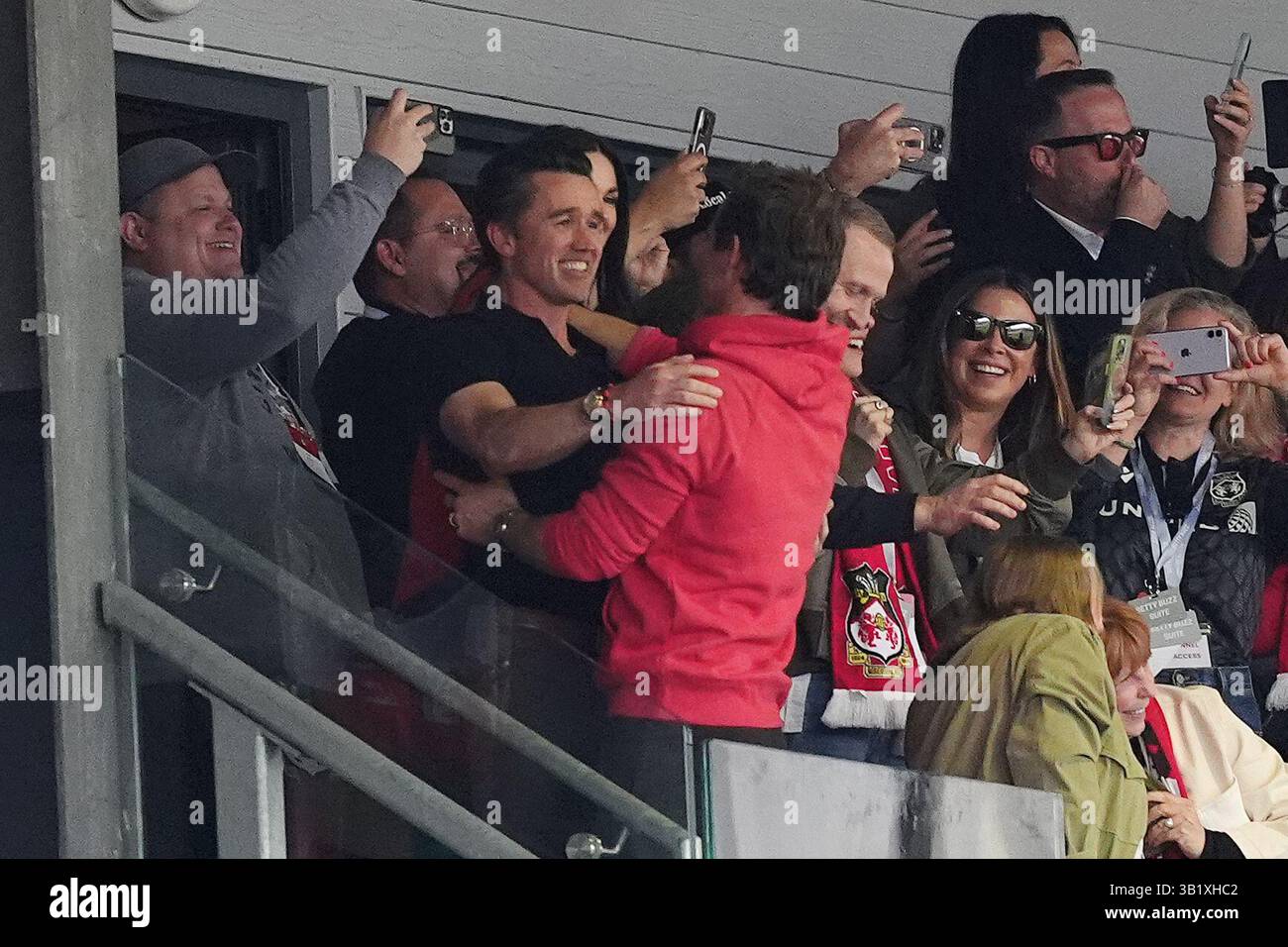 Wrexham co-owners Ryan Reynolds (centre right) and Rob McElhenney ...