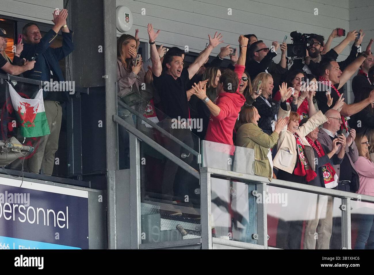 Wrexham co-owners Ryan Reynolds (centre right) and Rob McElhenney ...
