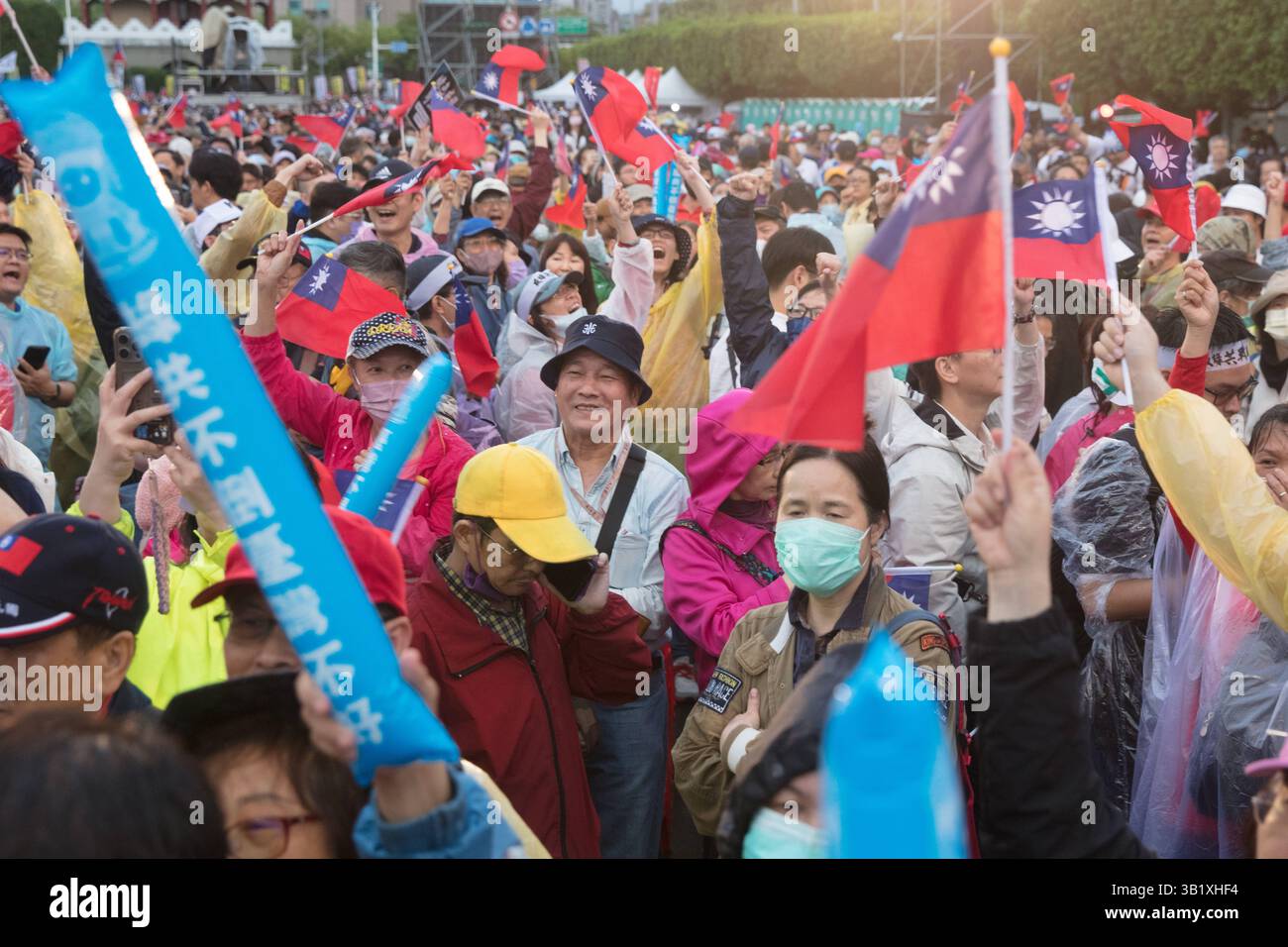 Supporters of the KuomintangKMT wave flags and chant during a rally ...