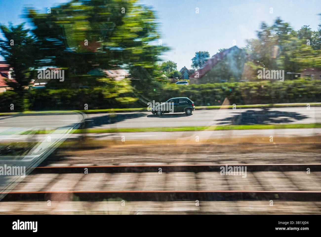 Small car in a city movement hi-res stock photography and images - Alamy