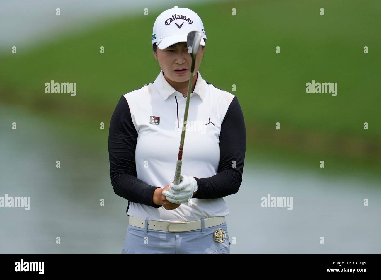 Yan Liu, of China, lines up a putt on the nineth green during the third round of the Chevron ...