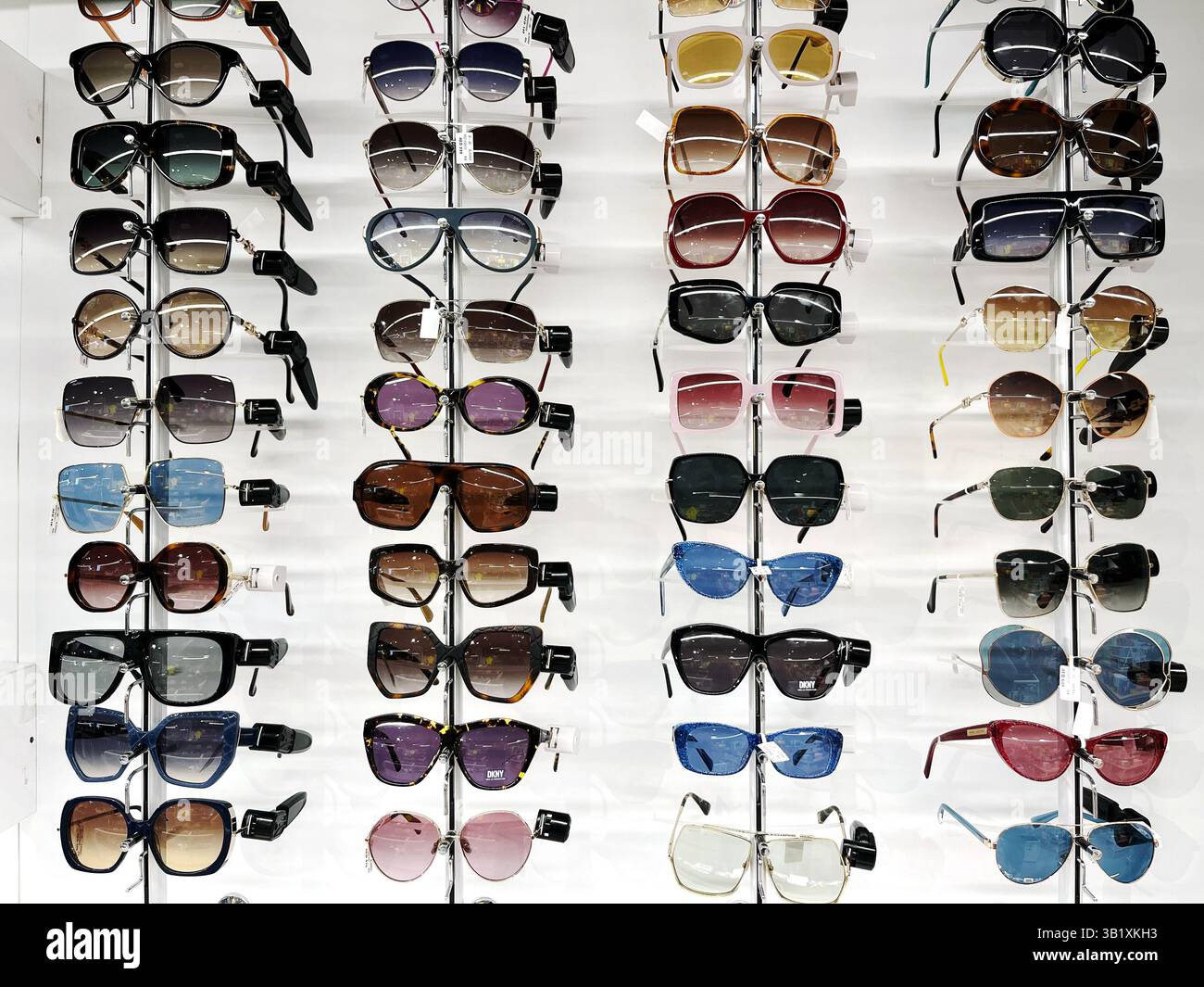 Display of a range of sunglasses on a shelf in an optical store. Dubai ...