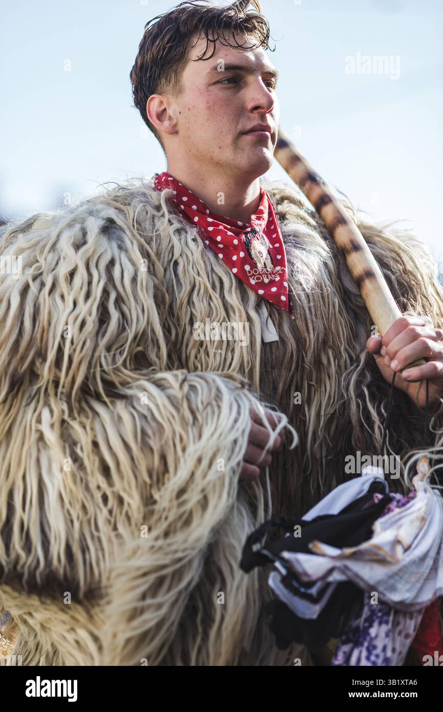 A kurent without his mask on carnival in Slovenia. It's a traditional ...
