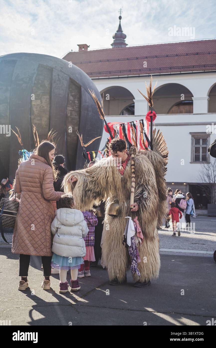A kurent without his mask on carnival in Slovenia. It's a traditional ...