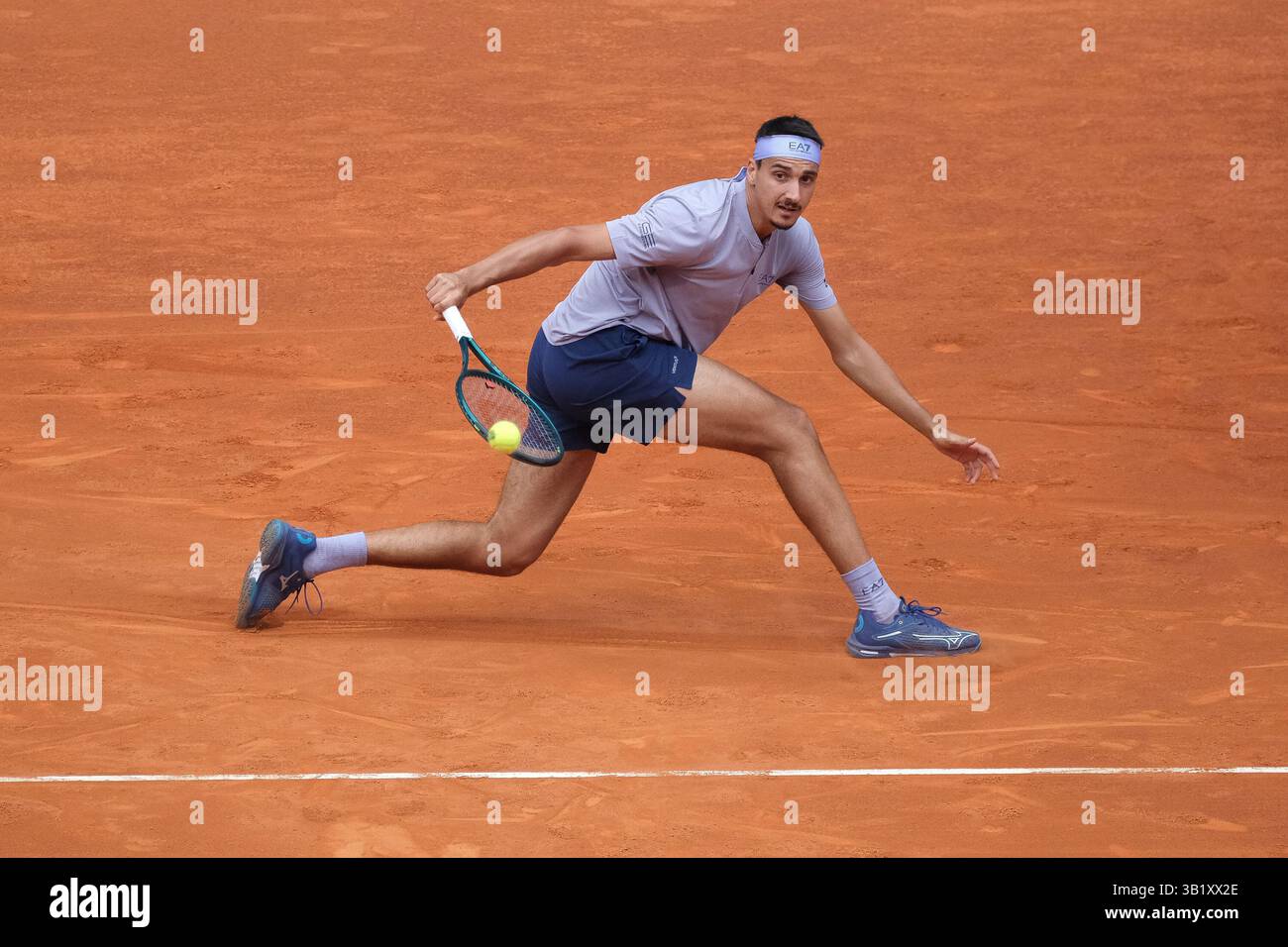 Lorenzo Sonego in action against Alex de Minaur the Mutua Madrid Open ...
