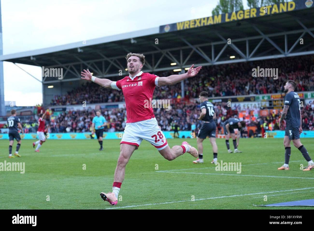 Wrexham's Sam Smith celebrates after scoring his side's third goal ...