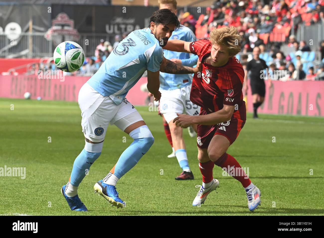 Toronto FC striker Charlie Sharp, right, fights for position against ...