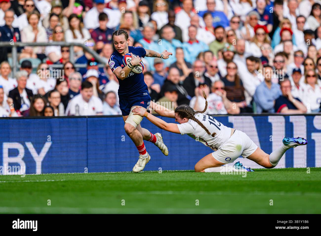 LONDON, UNITED KINGDOM. 26, Apr 25. Joanna Grisez is tackled during ...