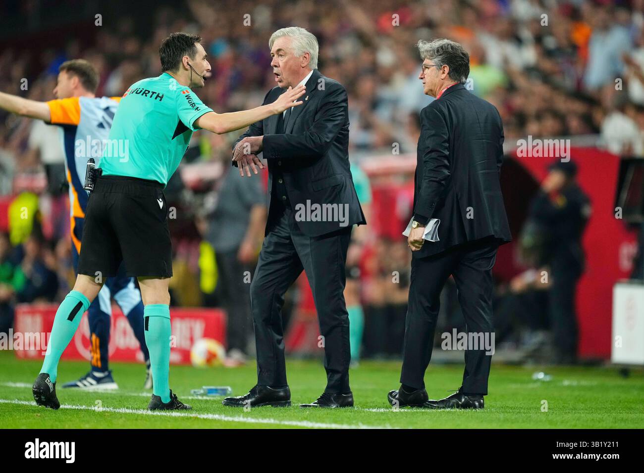 Real Madrid's head coach Carlo Ancelotti, centre, argues with referee ...