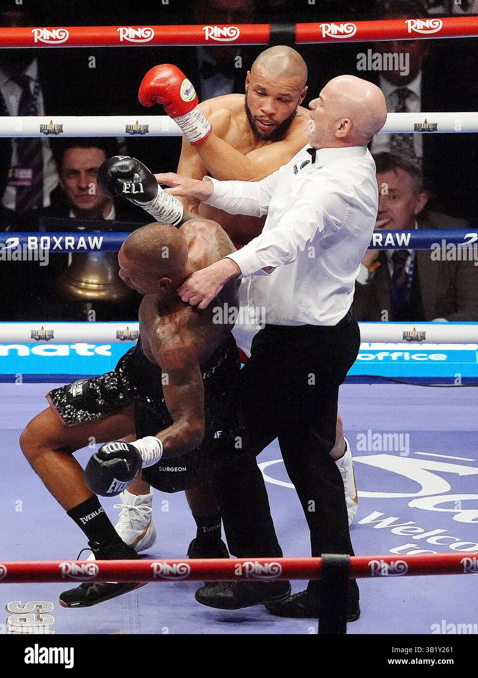 Referee Victor Loughlin (right) gets inbetween Chris Eubank Jr and ...