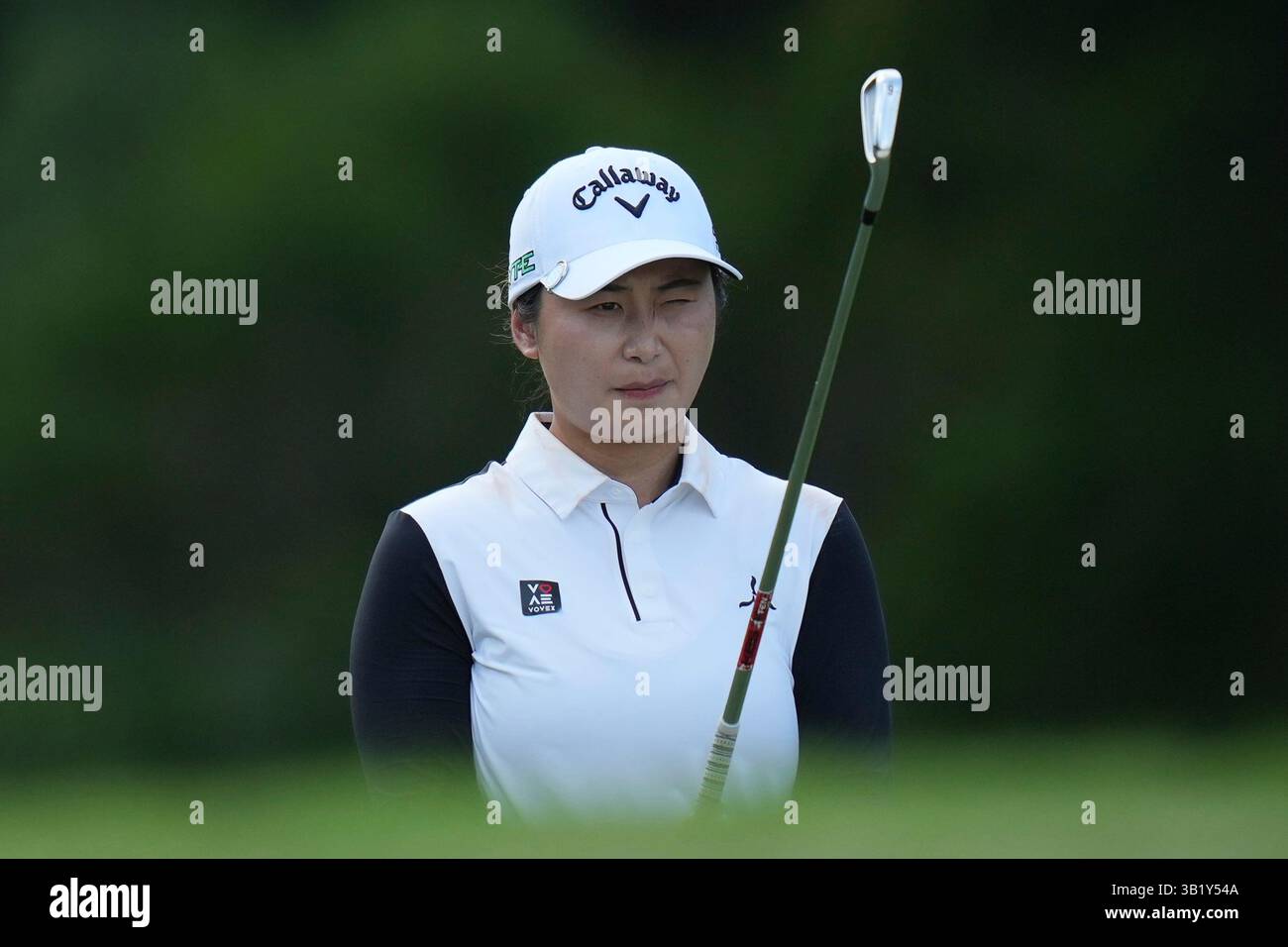 Yan Liu, of China, lines up a shot on the 16th hole during the third ...