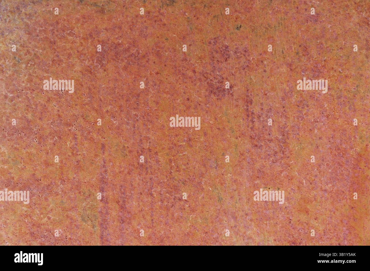 Close up view of a rusty iron sheet, highlighting the texture and color ...