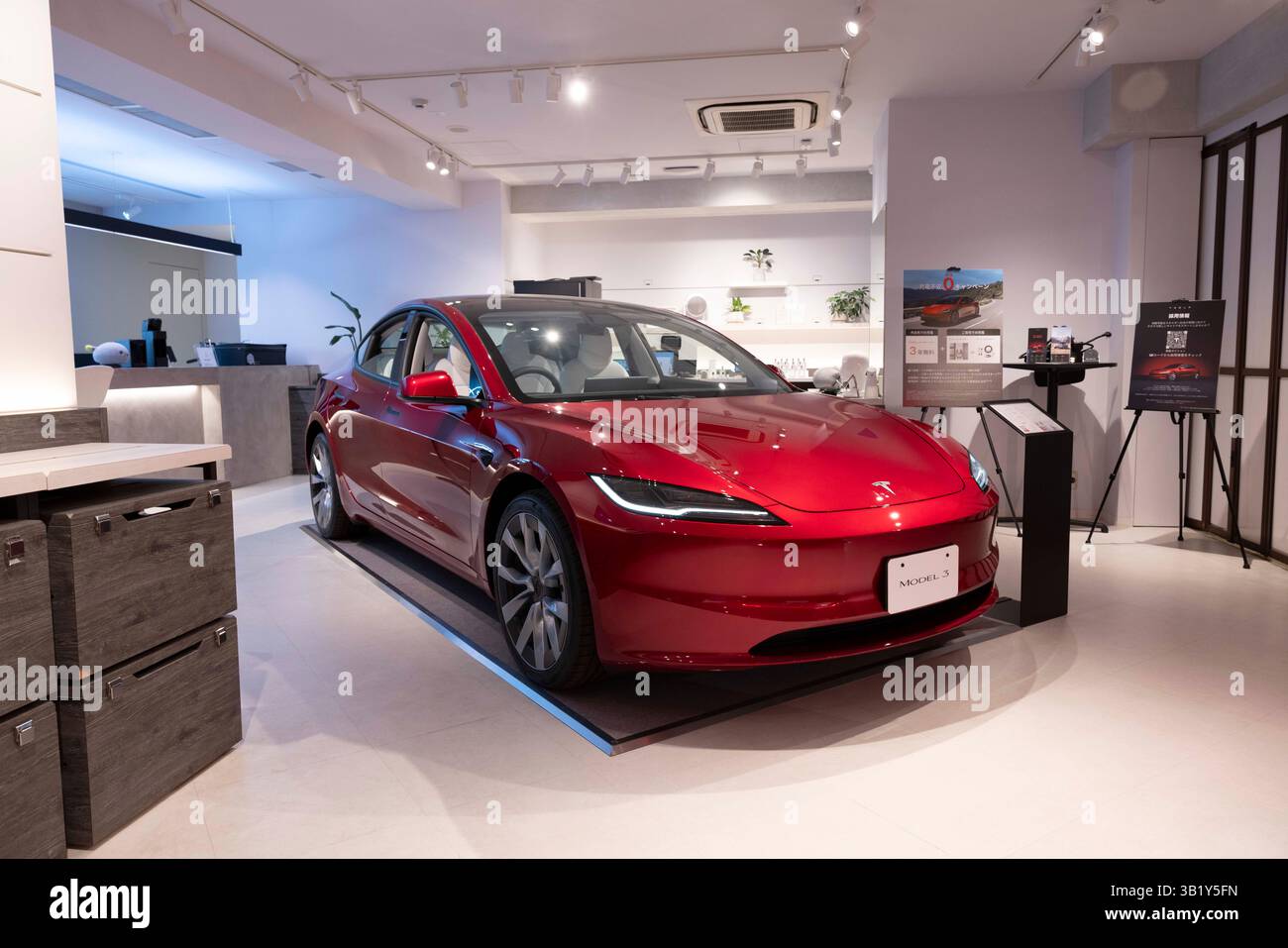 Tesla model 3 on display inside the Tesla pop-up store in Shibuya ...